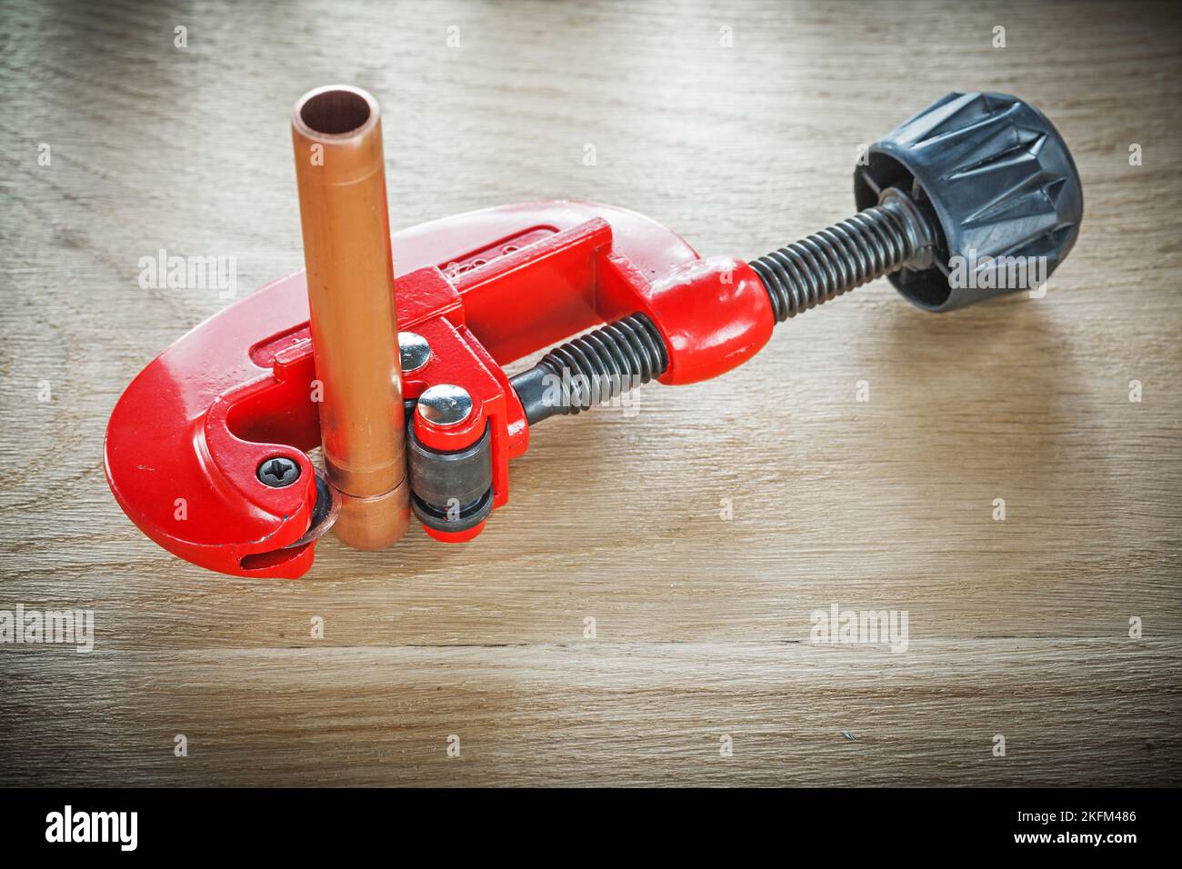 Flared pipes pipe cutter on wooden board top view Stock Photo - Alamy