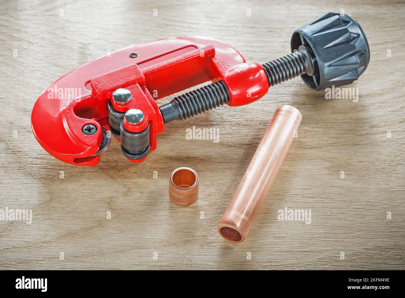 Flared pipes pipe scissors on wooden board Stock Photo - Alamy