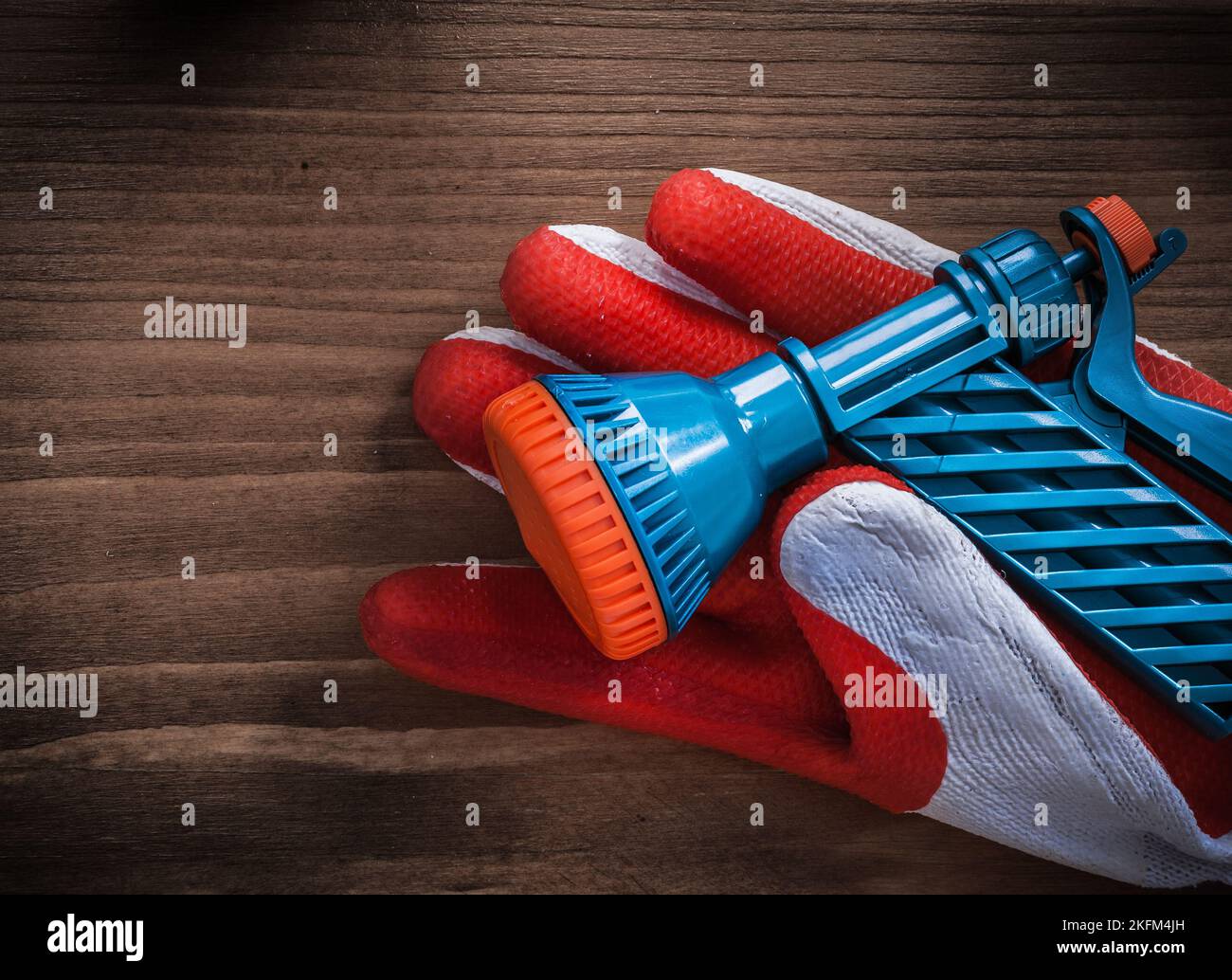 Gardening glove and water spray nozzle agriculture concept Stock Photo ...