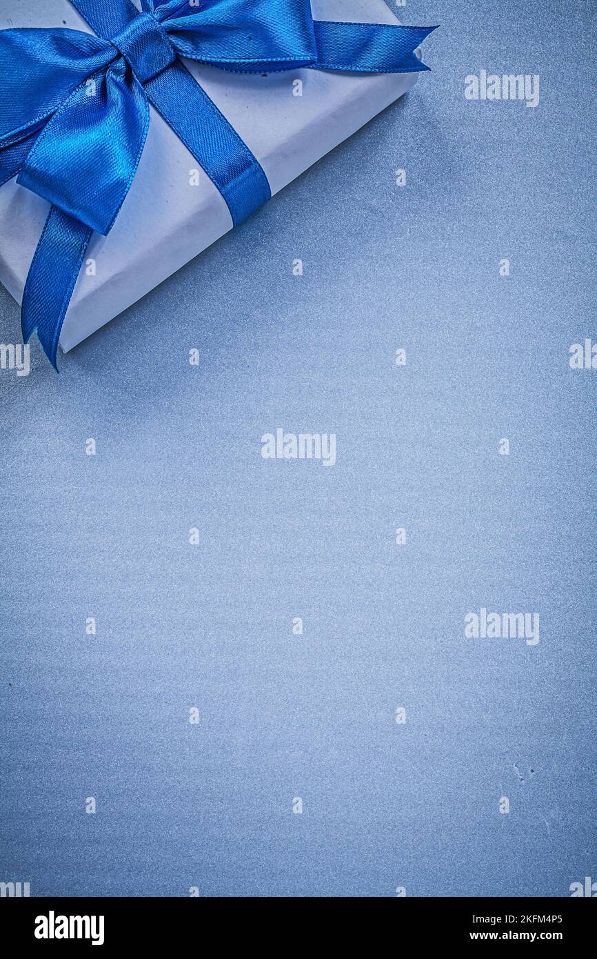 Gift box on blue background copy space holidays concept Stock Photo - Alamy