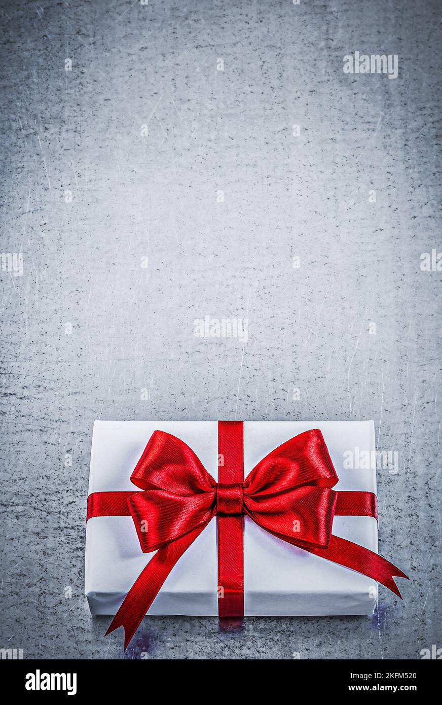 Giftbox with red tape on metallic background copyspace holidays concept ...