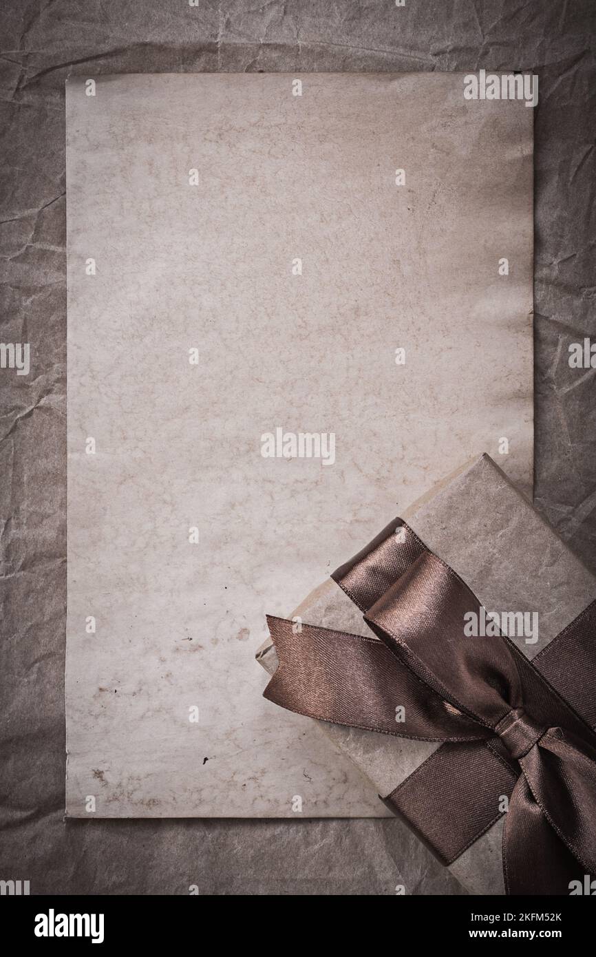 Giftbox with ribbon sheet of wrapping paper holidays concept Stock ...