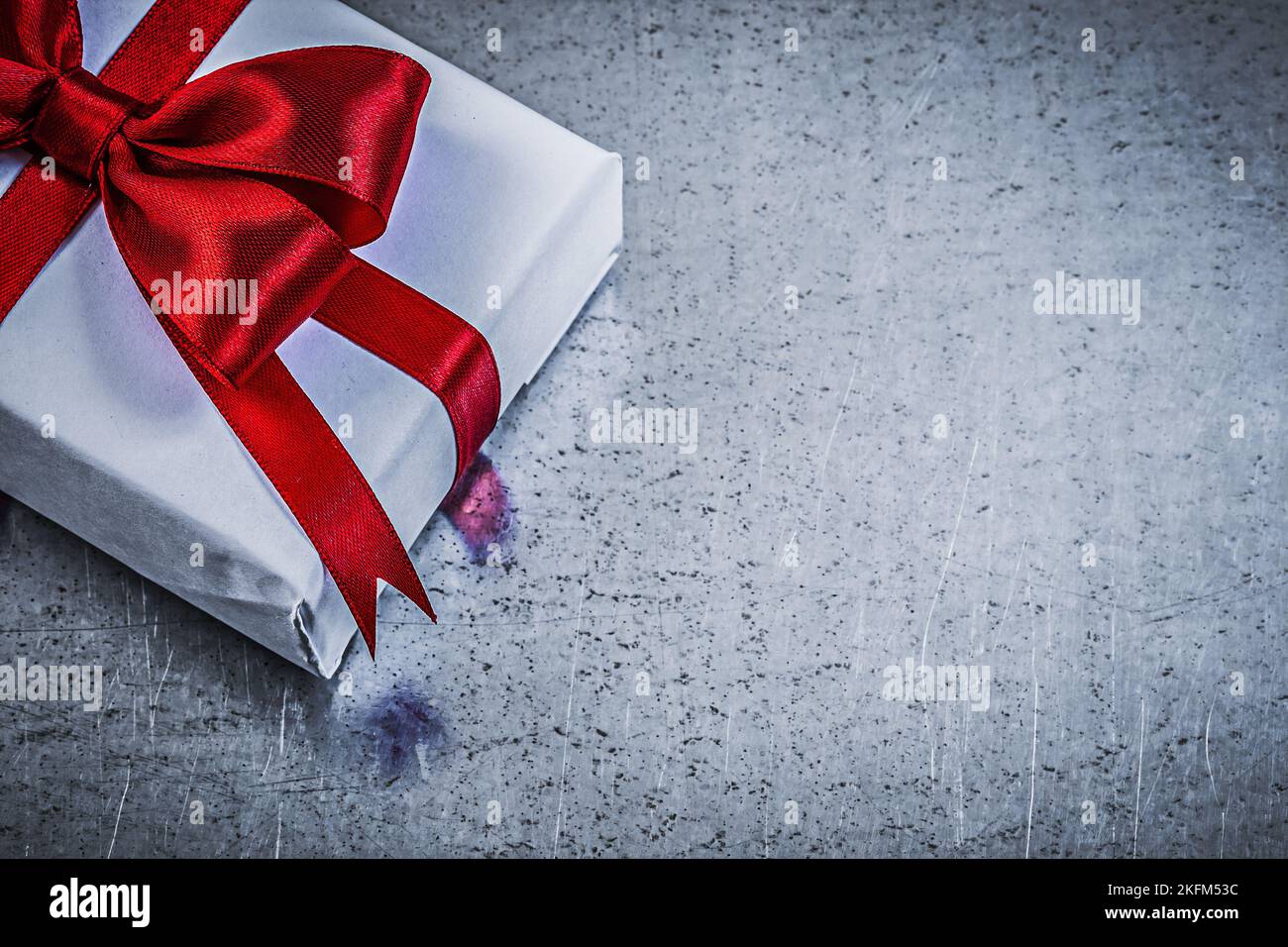 Giftbox with red ribbon on metallic background holidays concept Stock ...