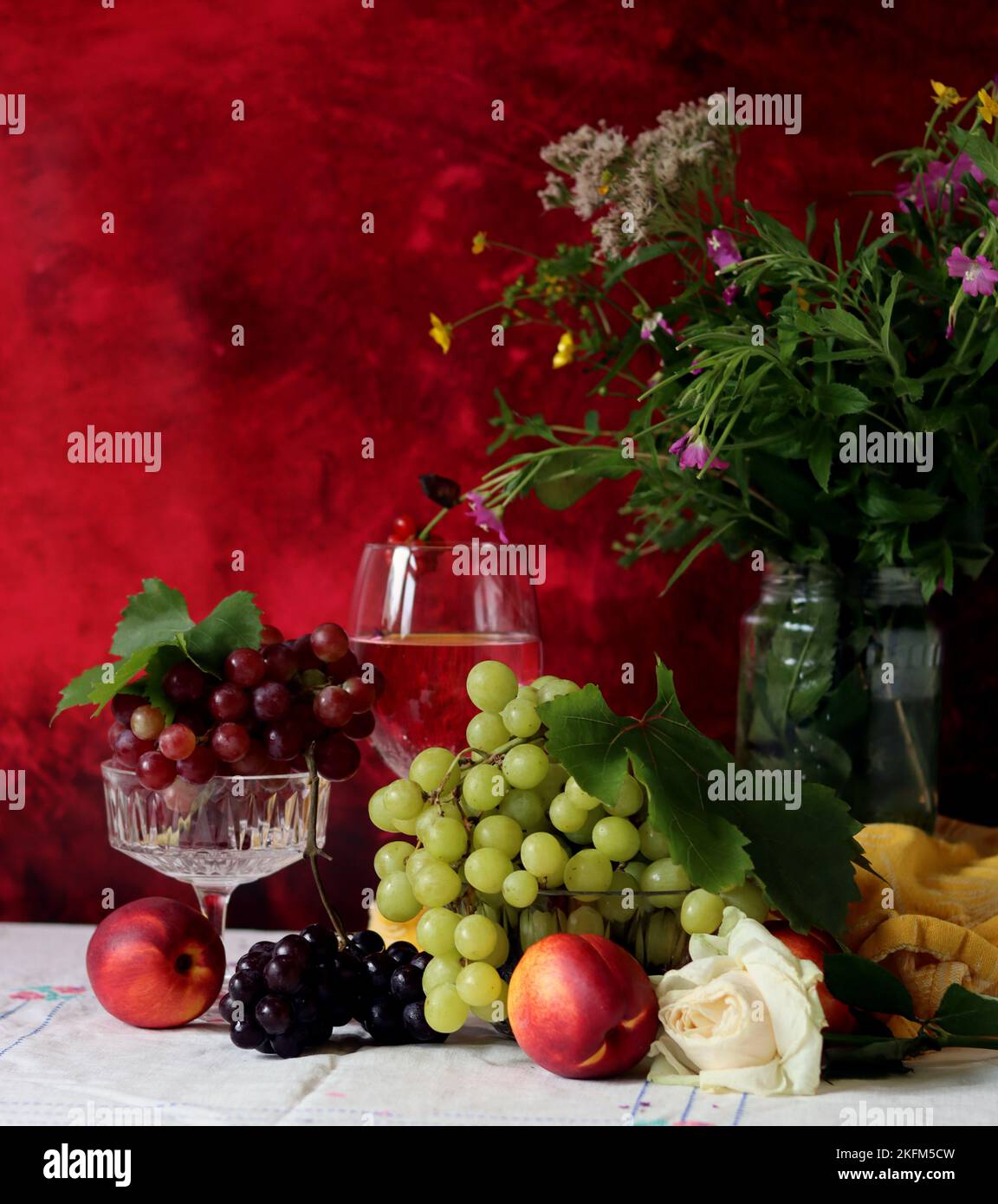 Colorful still life with seasonal berries on a table. Red currant ...