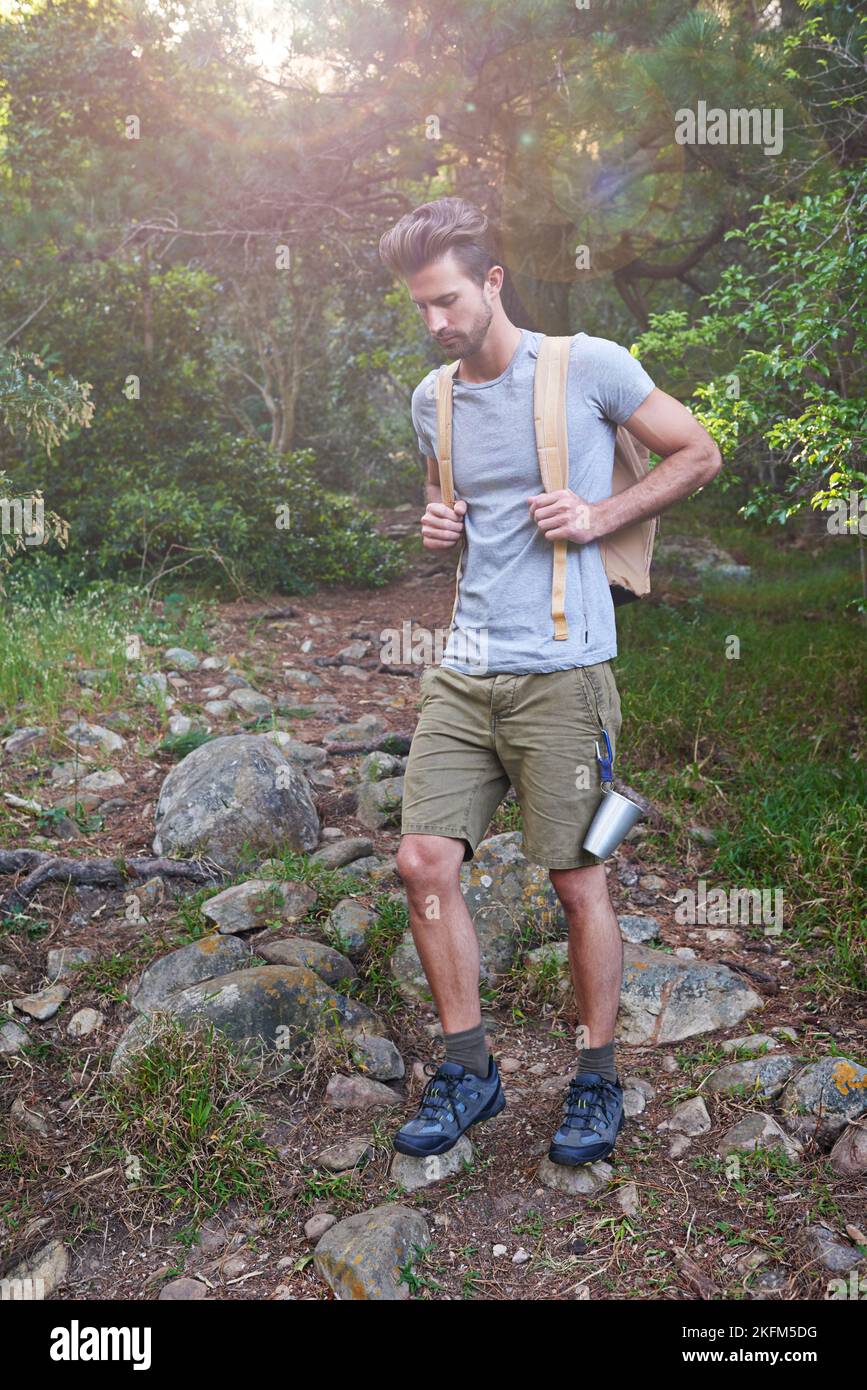 The greatest adventure is what lies ahead. a handsome man hiking in the ...