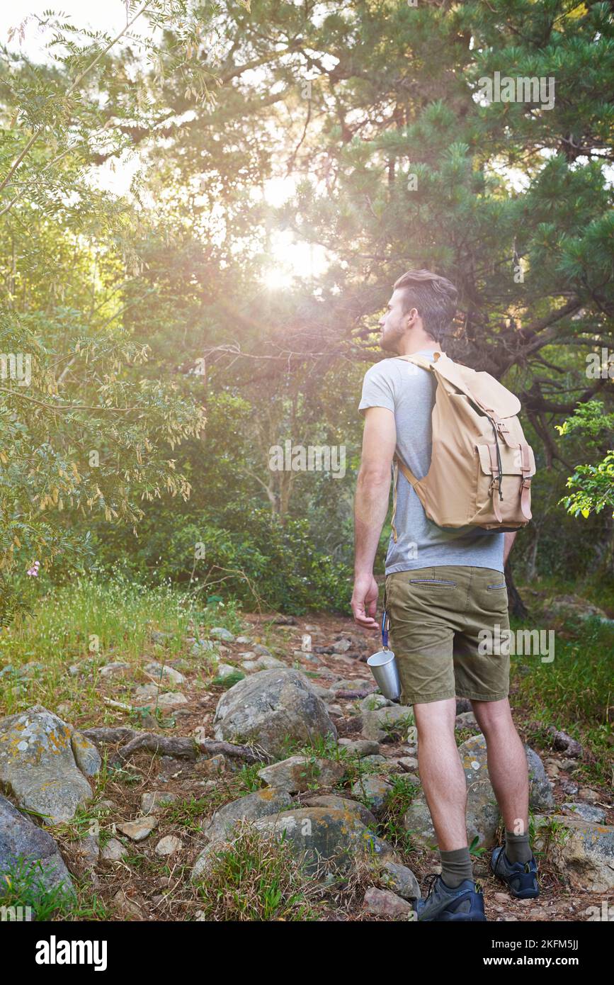 Not all those who wander are lost. A young man looking at the nature ...