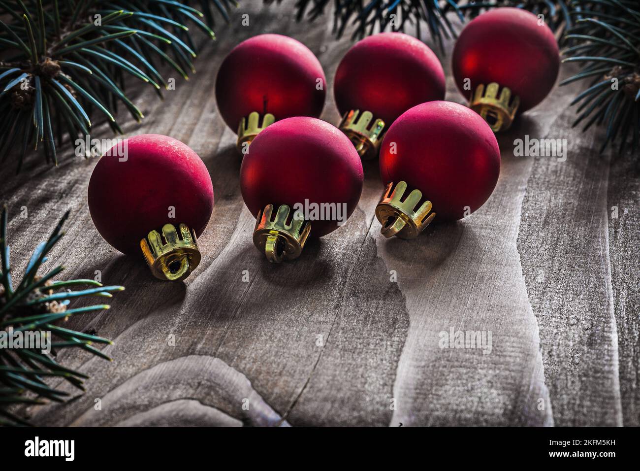 group of small red christmas baubles on board Stock Photo - Alamy