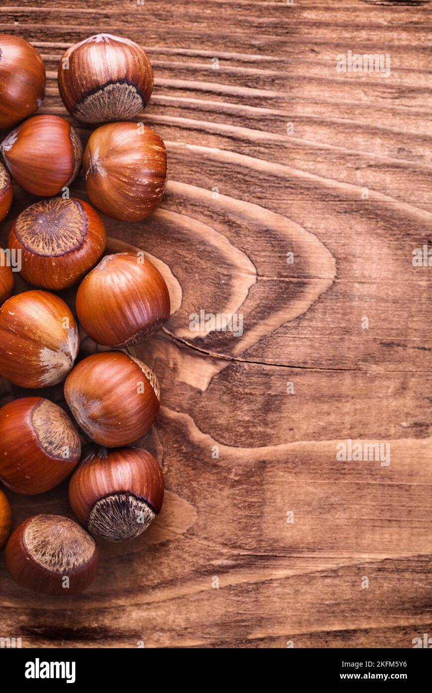 hazelnuts on vintage wooden board food and drink concept Stock Photo ...