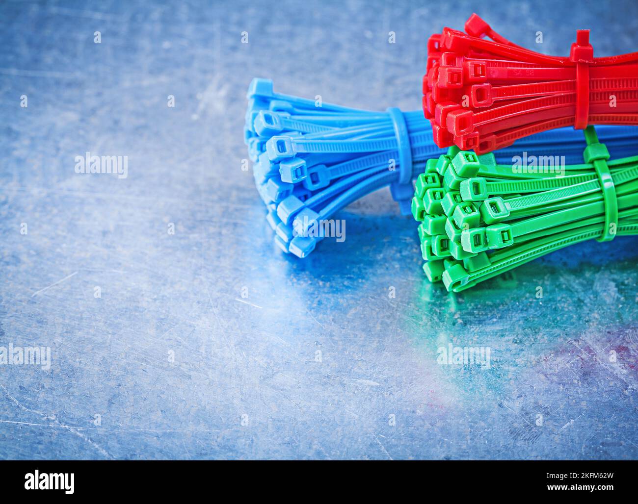 Horizontal version of cable ties on metallic background construction ...