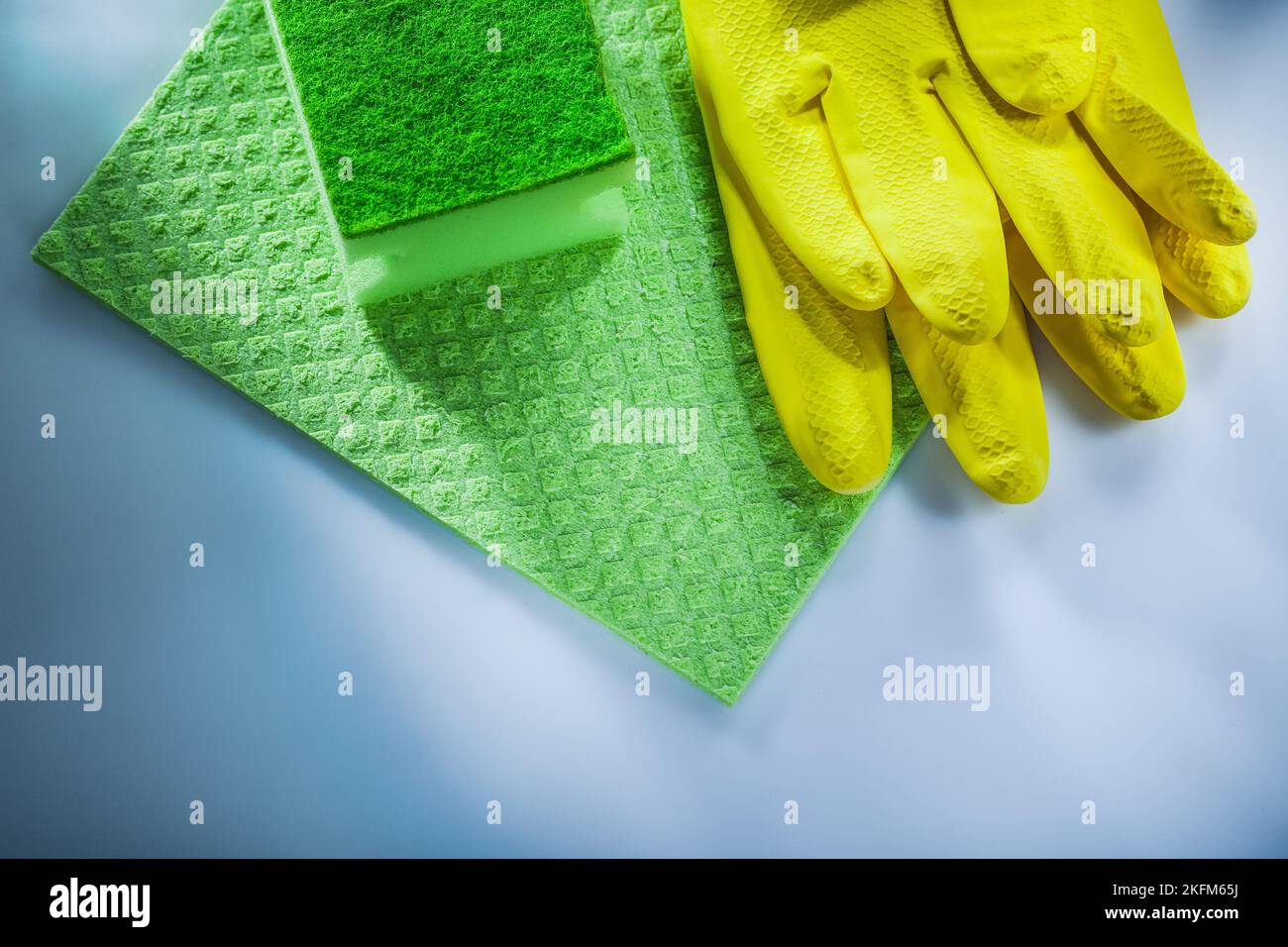 Household washcloth sponge safety gloves on white surface Stock Photo ...
