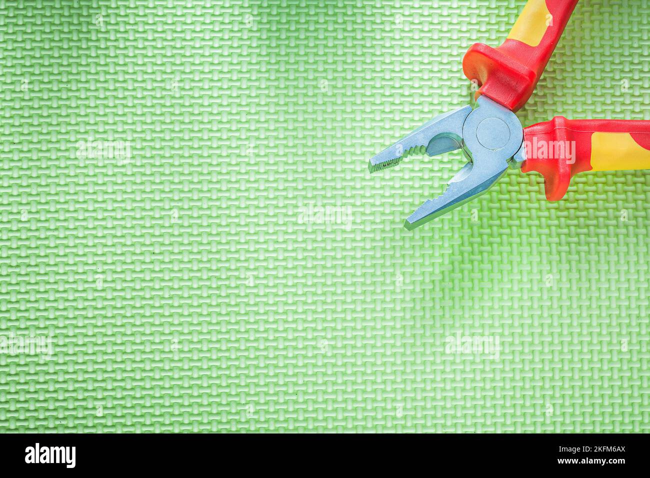 Insulation pliers on green background electricity concept Stock Photo ...