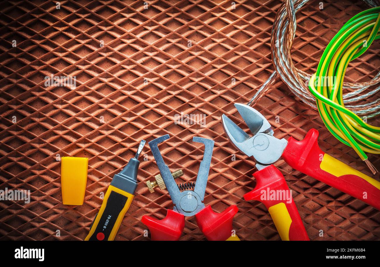 Insulation strippers cutter electrical cable tester on dielectric mat ...