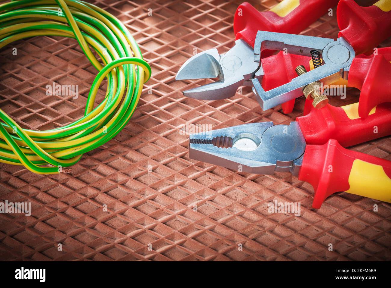 Insulation strippers electric wire cutter pliers on dielectric mat ...