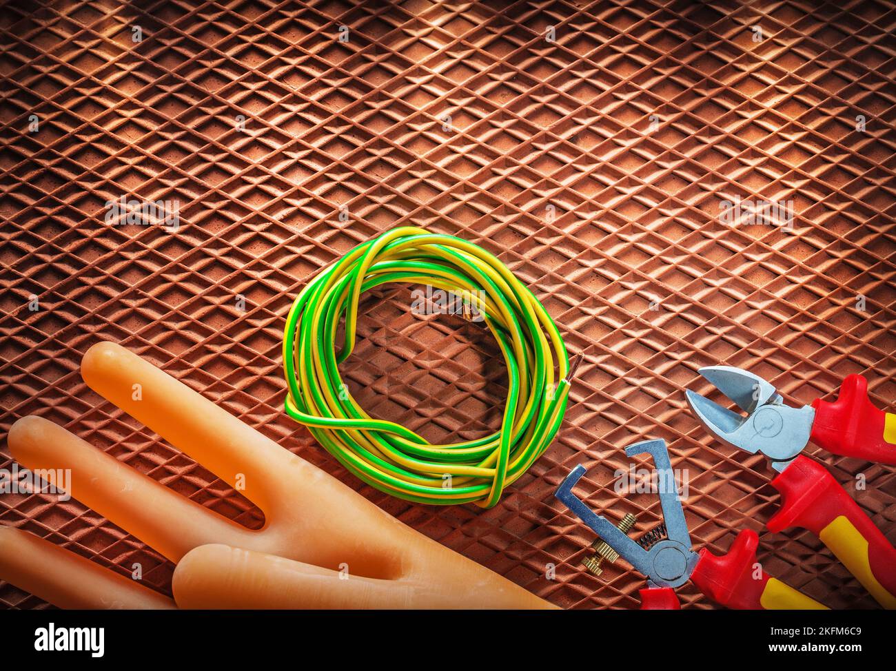 Insulation wire strippers cutter electric cable electricians gloves on ...