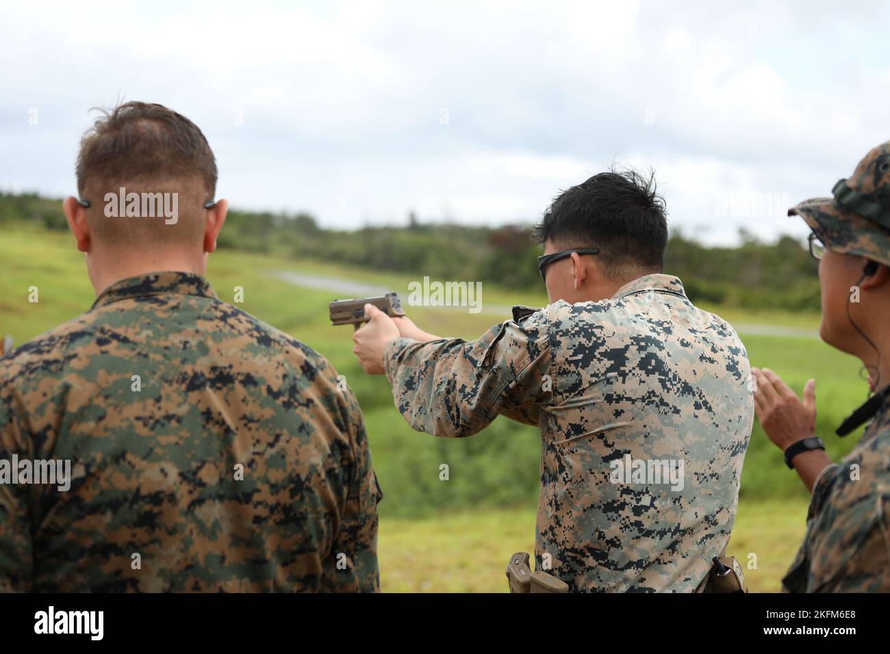 U.S. Marine Corps Lance Cpl. Thomas Sheng, a combat photographer with ...
