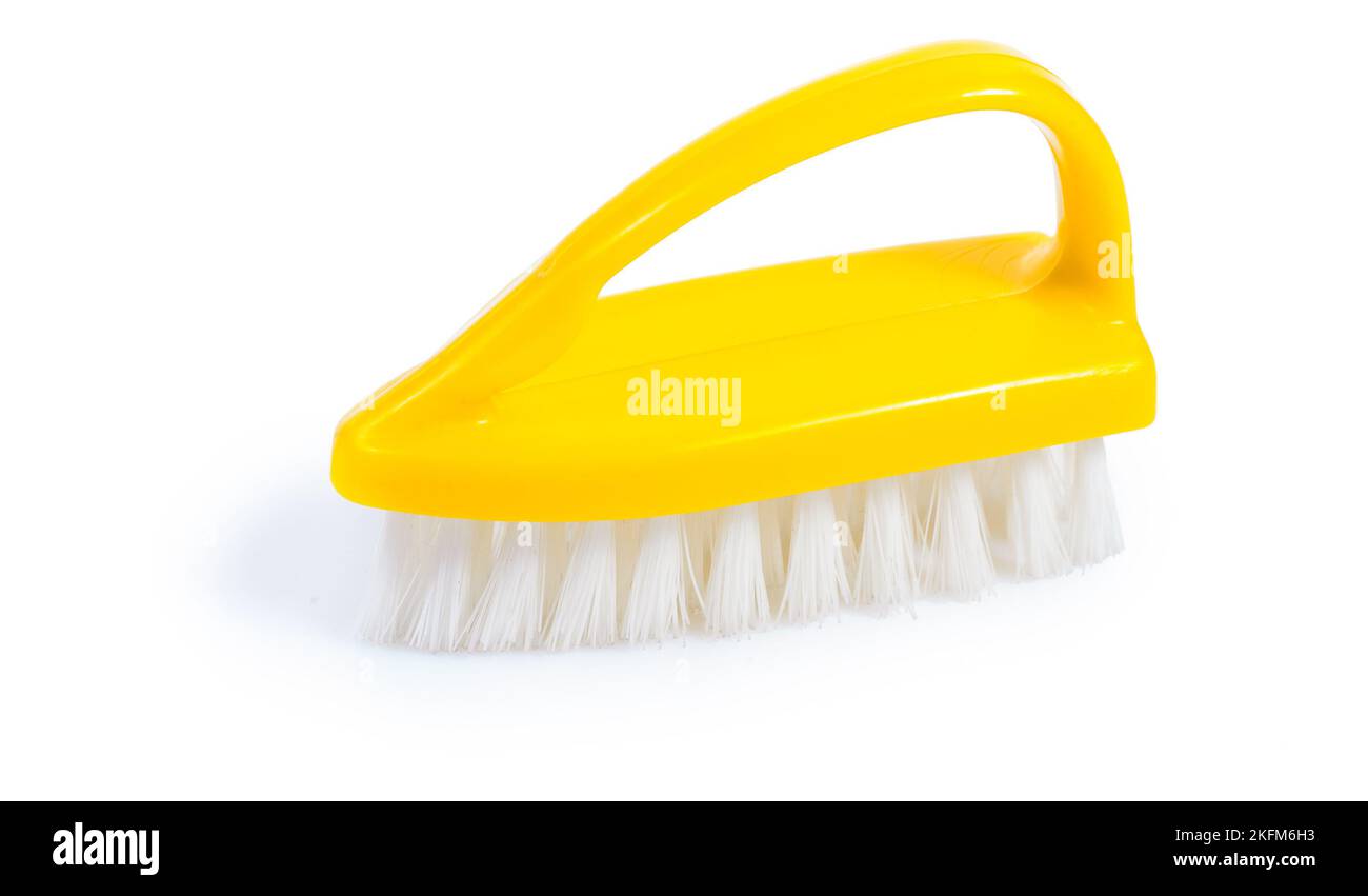 kitchen scrubbrush with yellow handle isolated on white background ...