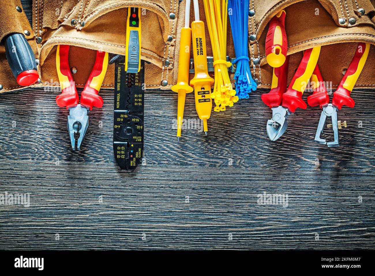 Leather construction belt electric tools on wooden board electricity ...