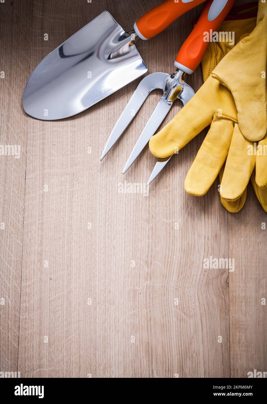 Leather protective gloves agriculture trowel fork and hand spade on ...