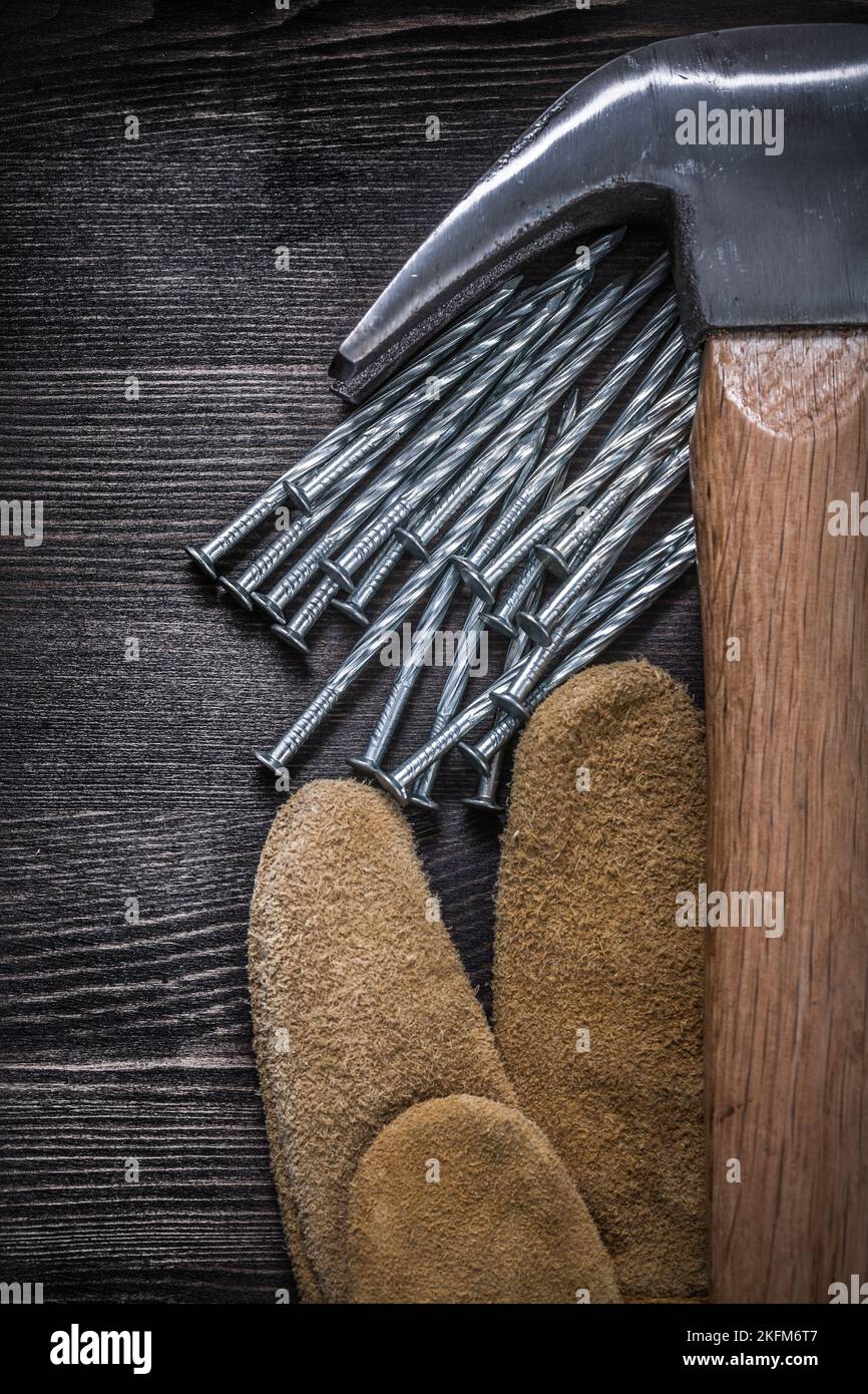 Leather safety gloves construction nails claw hammer vertical view ...