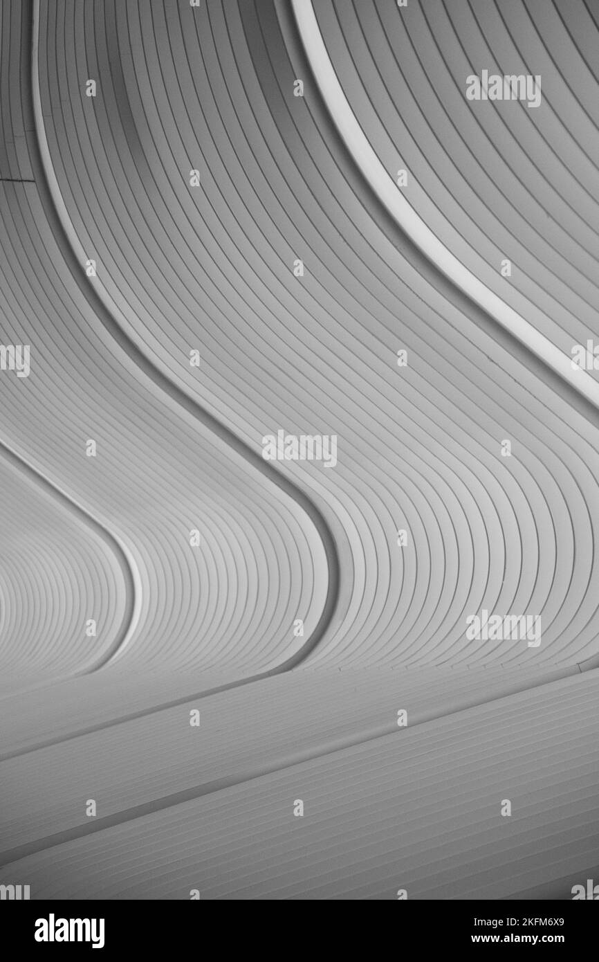 A minimalistic grayscale of modern design of a wall with curvy lines ...