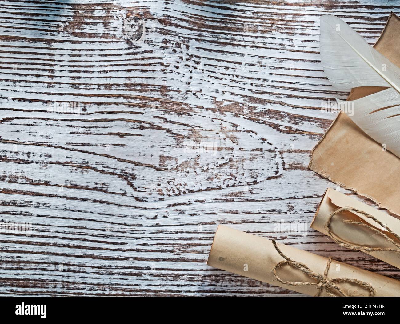 Medieval parchment roll of paper plume on vintage wooden board Stock ...
