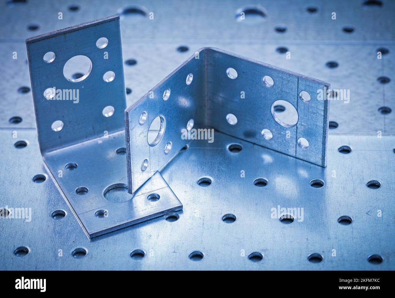 Metal drilled angle bars on perforated metallic sheet construction ...