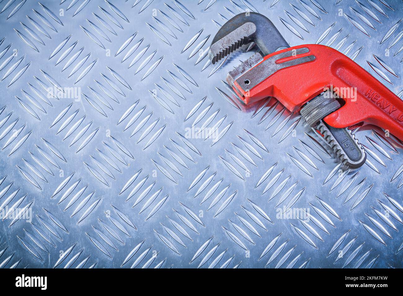 Metal pipe wrench on channeled metallic sheet maintenance concept Stock ...