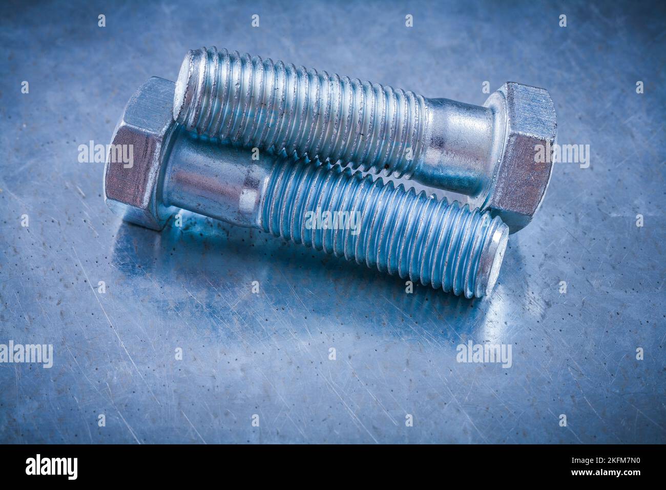 Metal screw bolts on metallic surface construction concept Stock Photo ...