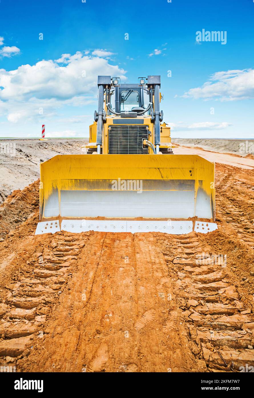 new bulldozzer on construction site Stock Photo - Alamy