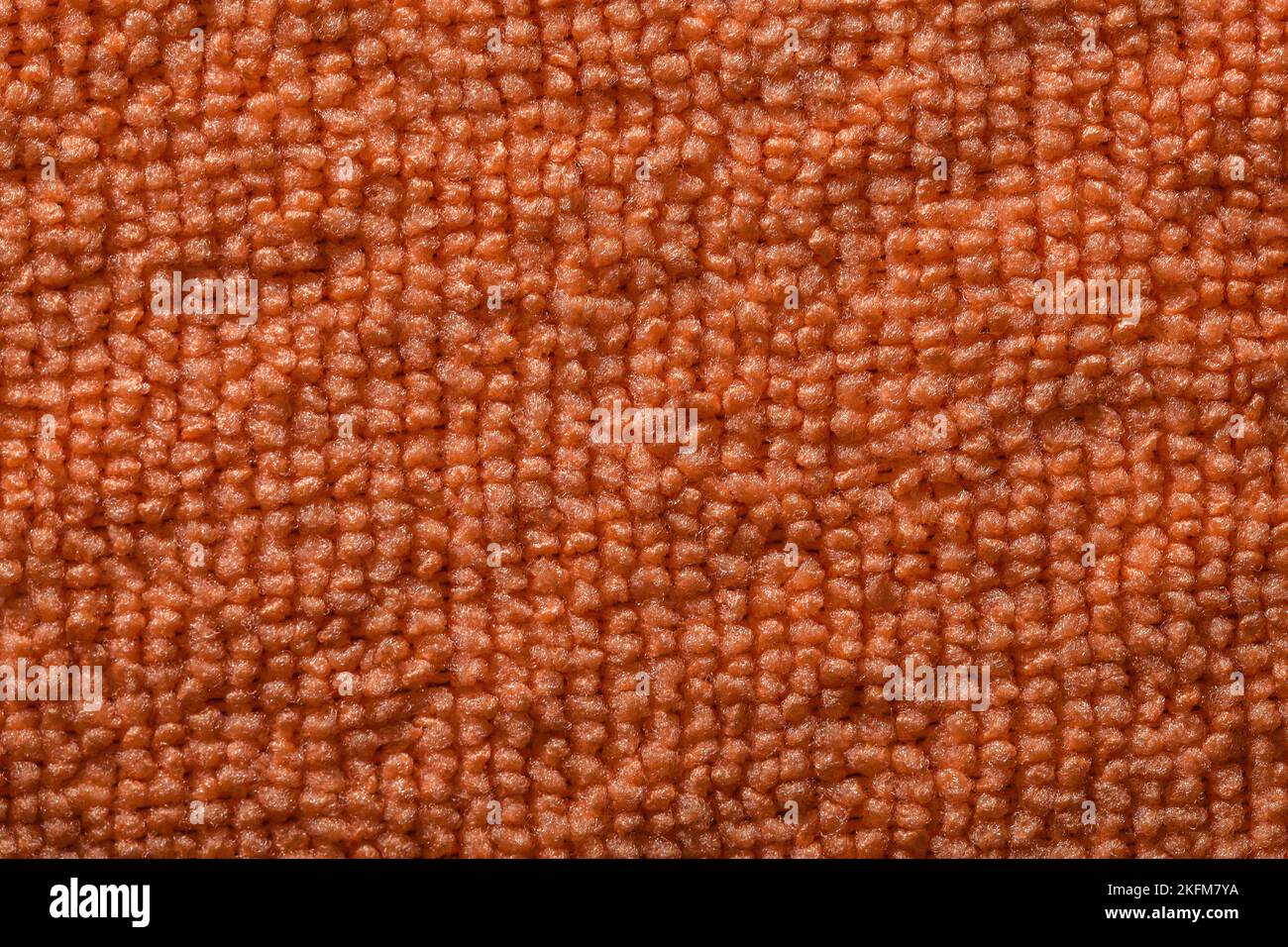 New kitchen orange dishwashing cloth Stock Photo - Alamy