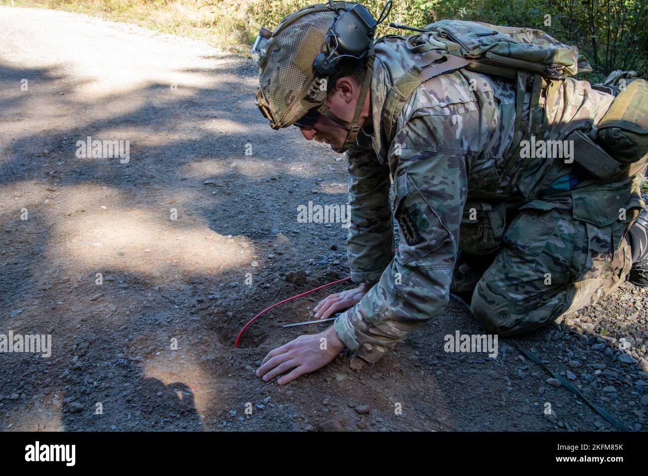 Staff Sgt. Chris Martin from the U.S. Army 192nd EOD Battalion observes ...