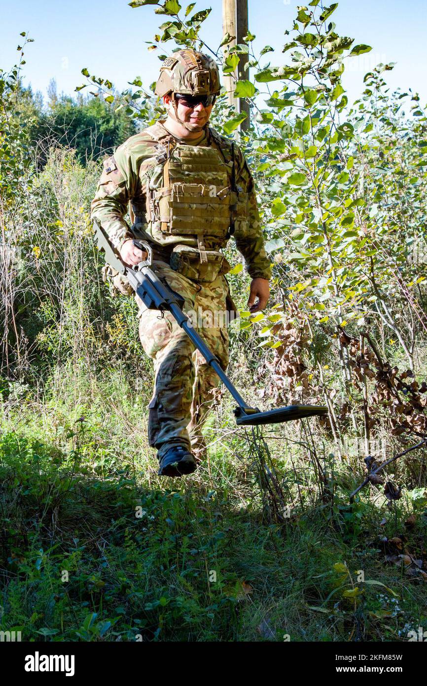 Sgt. Eric Leith from the U.S. Army 192nd EOD Battalion examines the ...