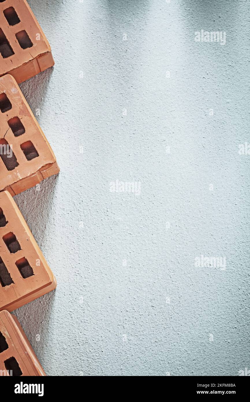 Orange construction bricks on concrete surface copy space building ...