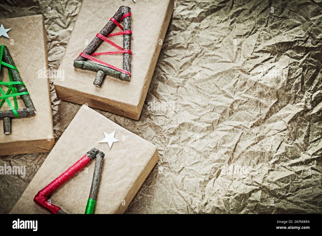 Packaged Christmas handmade present boxes on crumpled vintage paper ...