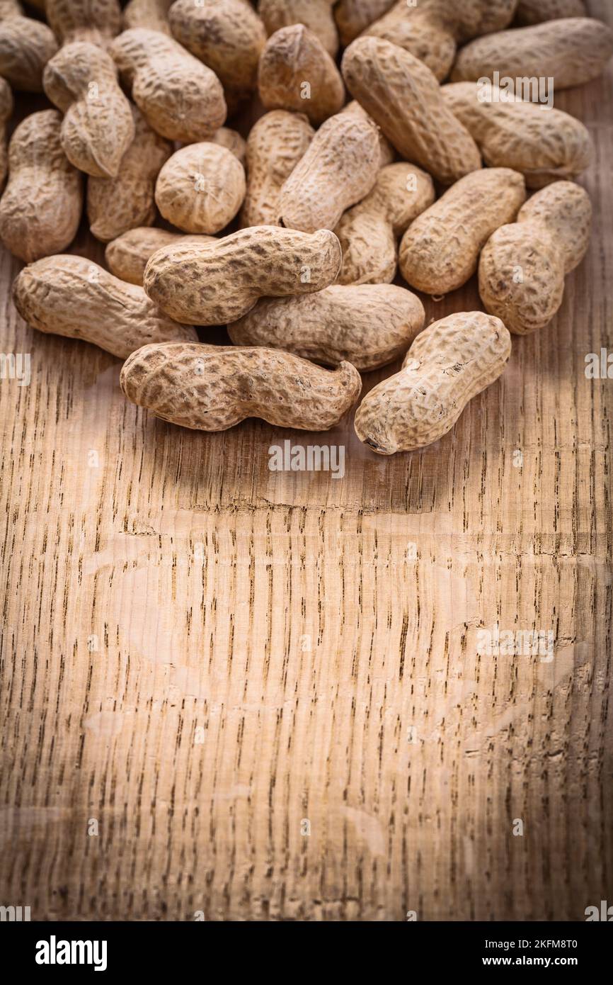 organized copyspace peanuts on vintage wooden board food and drink ...