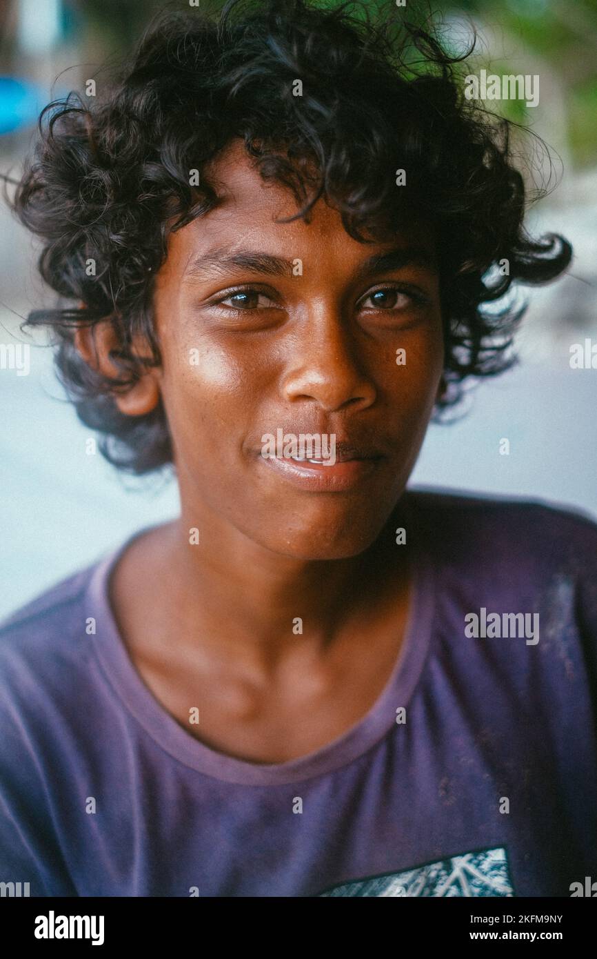 A vertical portrait of a smiling Sri Lankan kid Stock Photo - Alamy