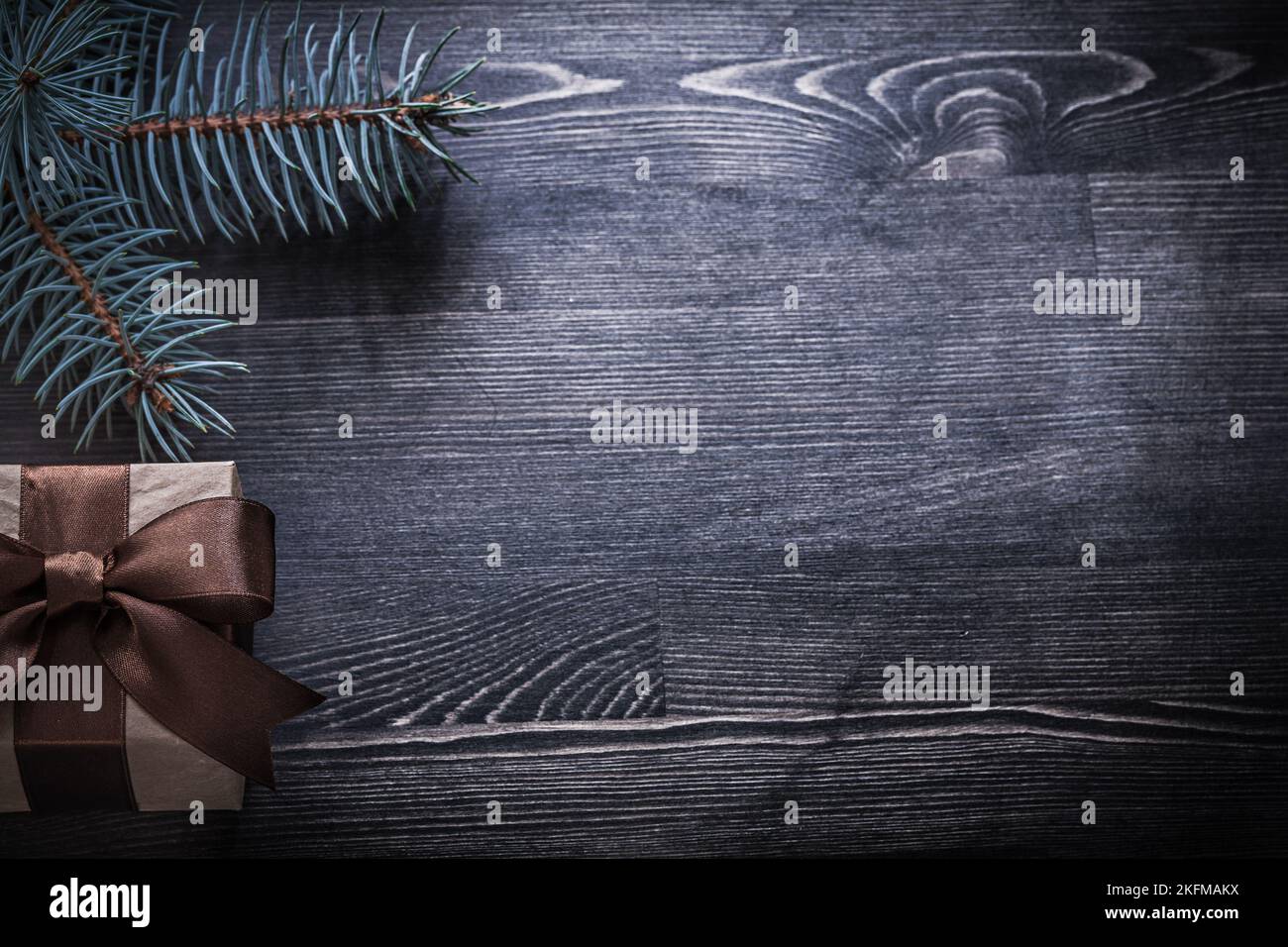 Pine tree branch present box on wooden board holiday concept Stock ...