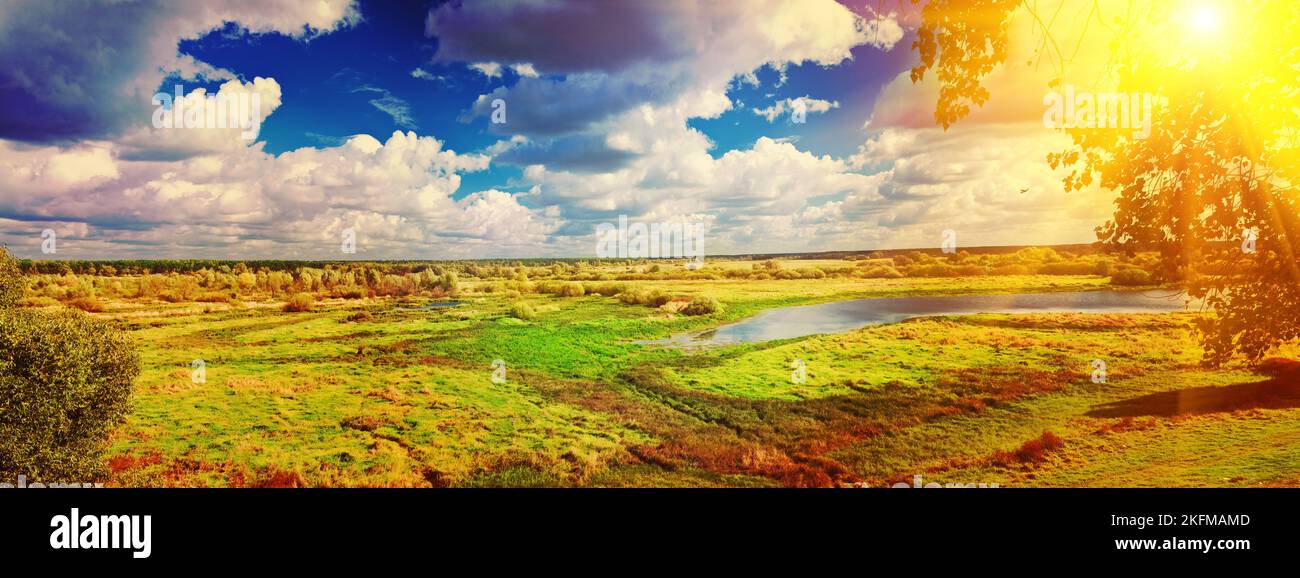 panoramic view on big meadow with small flood sky with sun instagram ...