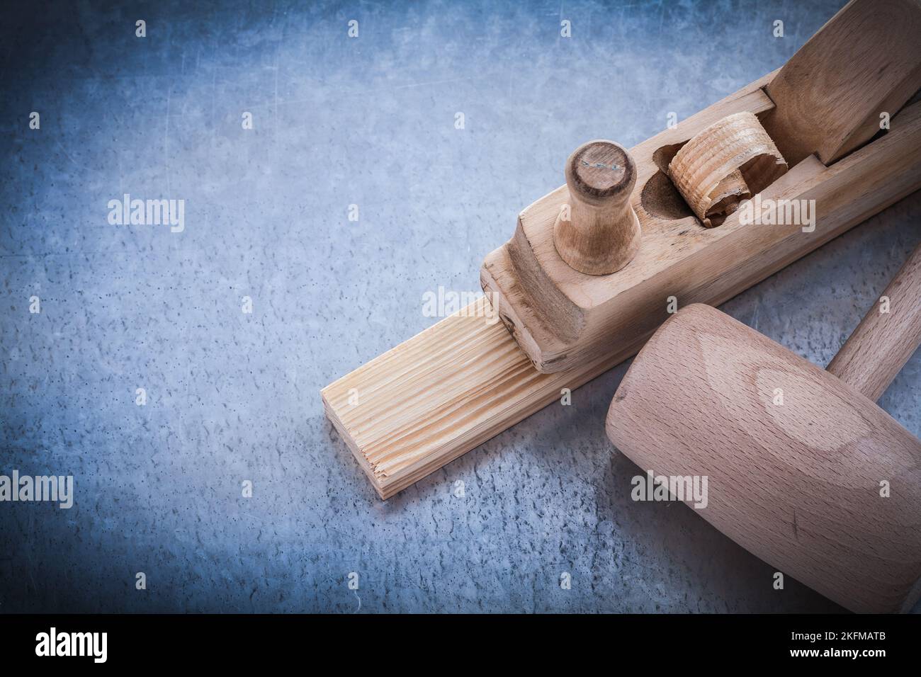 Planer lump hammer wooden stud on metallic background construction ...