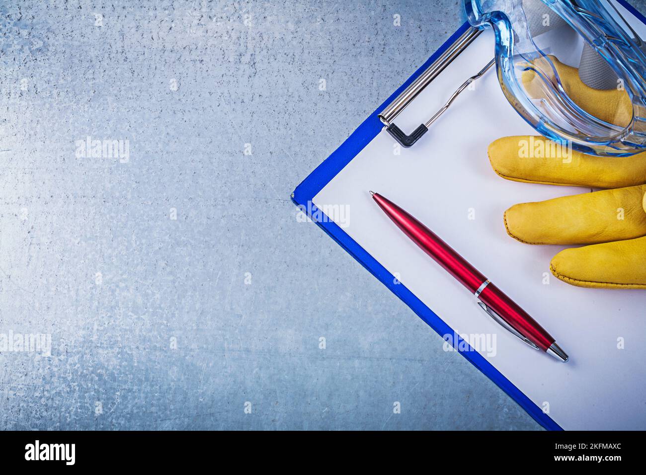 Plastic goggles protective gloves notepad pen on metallic background ...