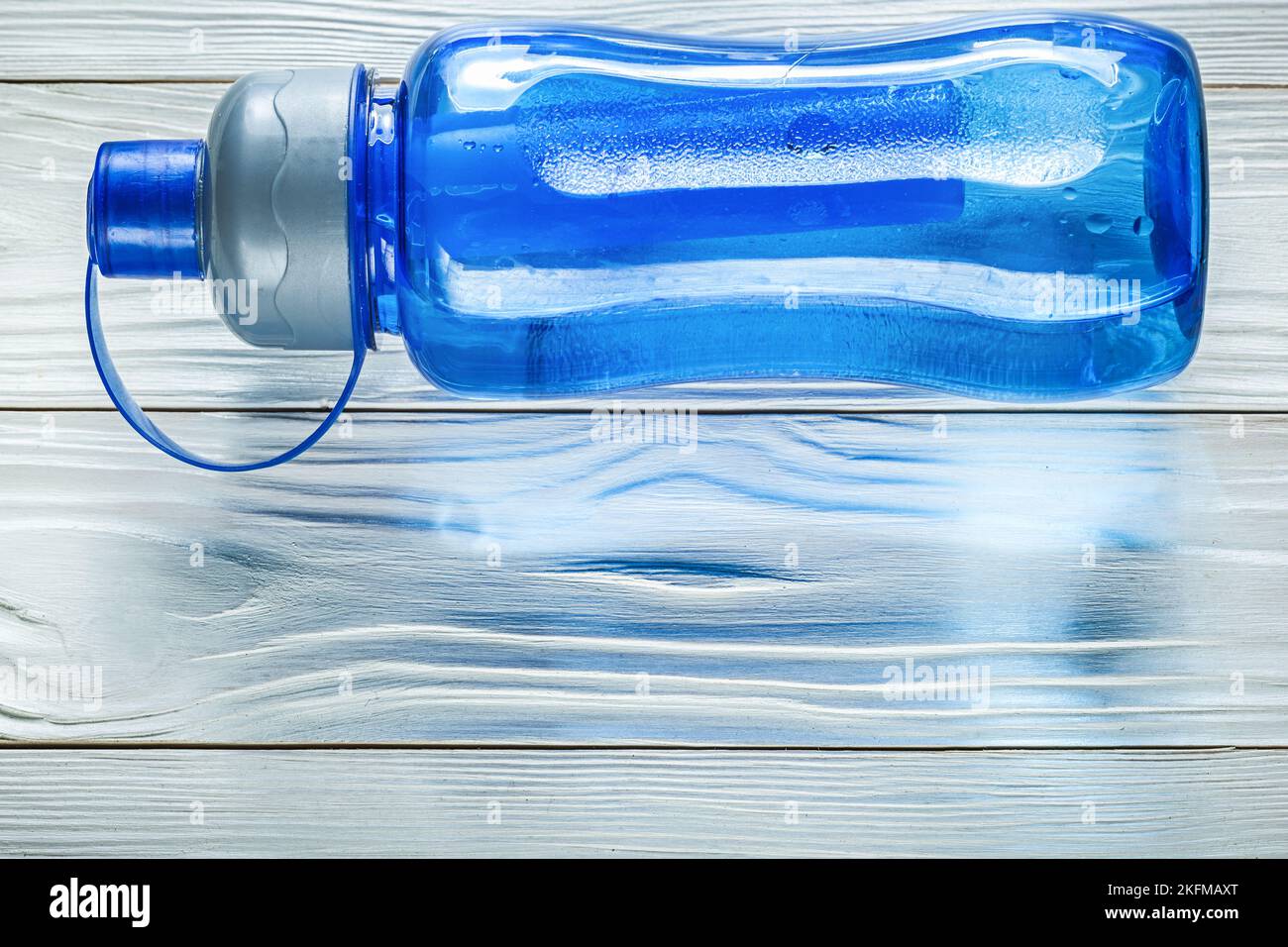 Plastic water bottle on wooden board sports training concept Stock ...