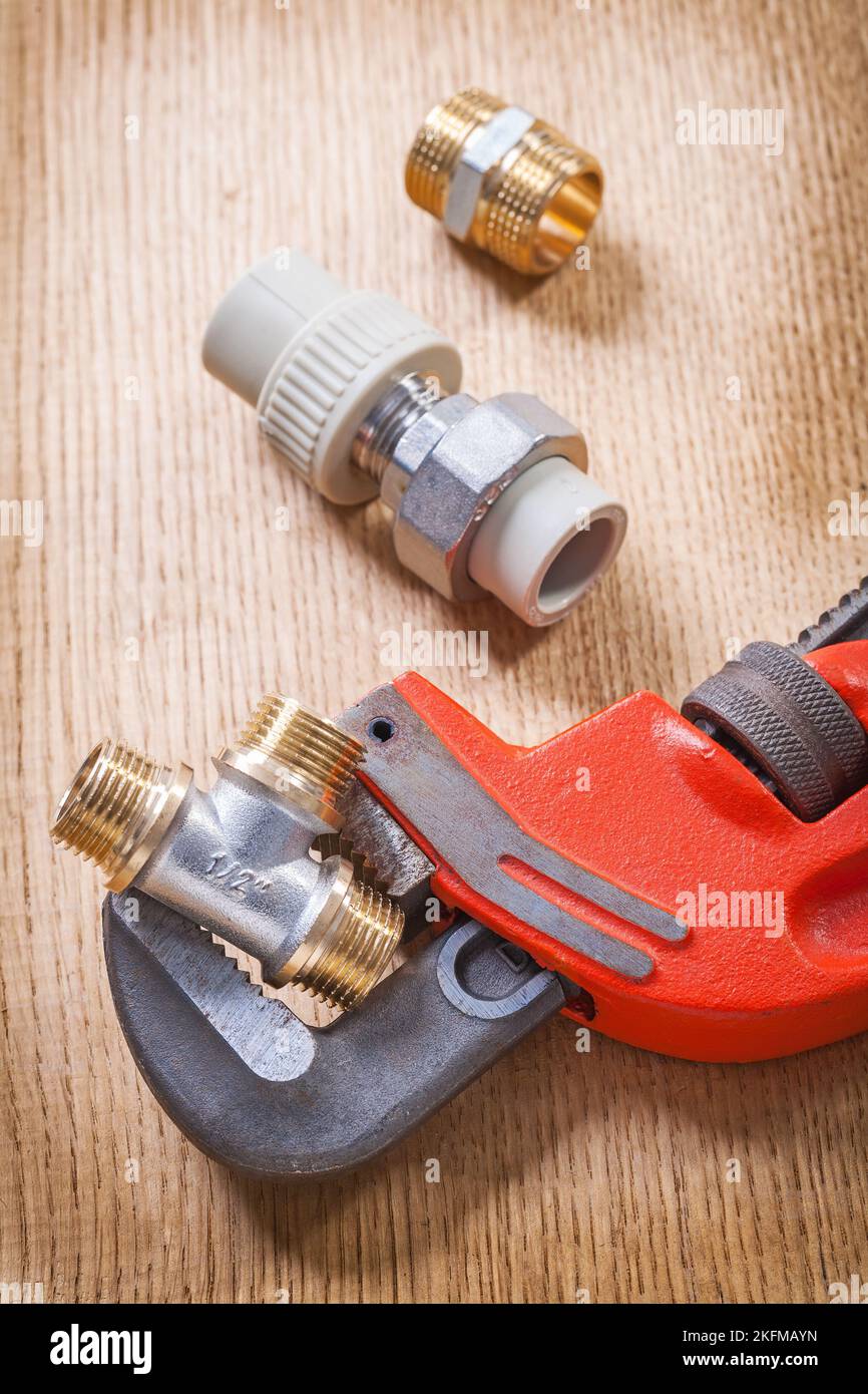 plumbers pipe fixtures and wrench Stock Photo - Alamy