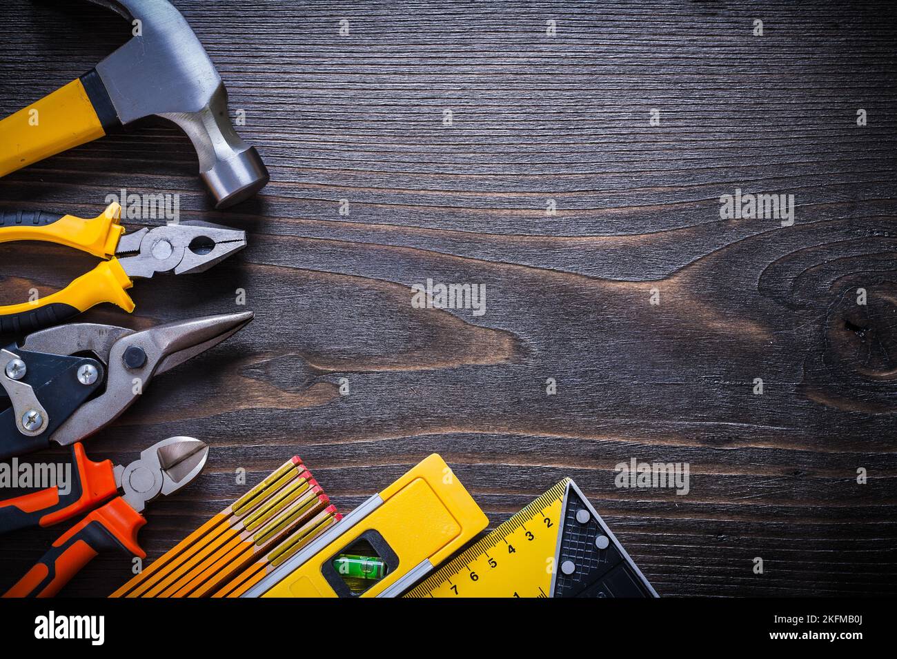 Pliers nippers tin snips claw hammer try square construction level and ...