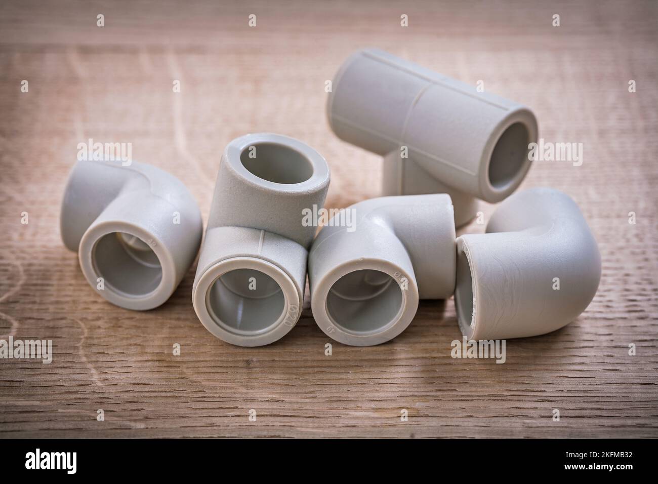 Polypropylene Pipe Fittings On Wooden Board Stock Photo - Alamy