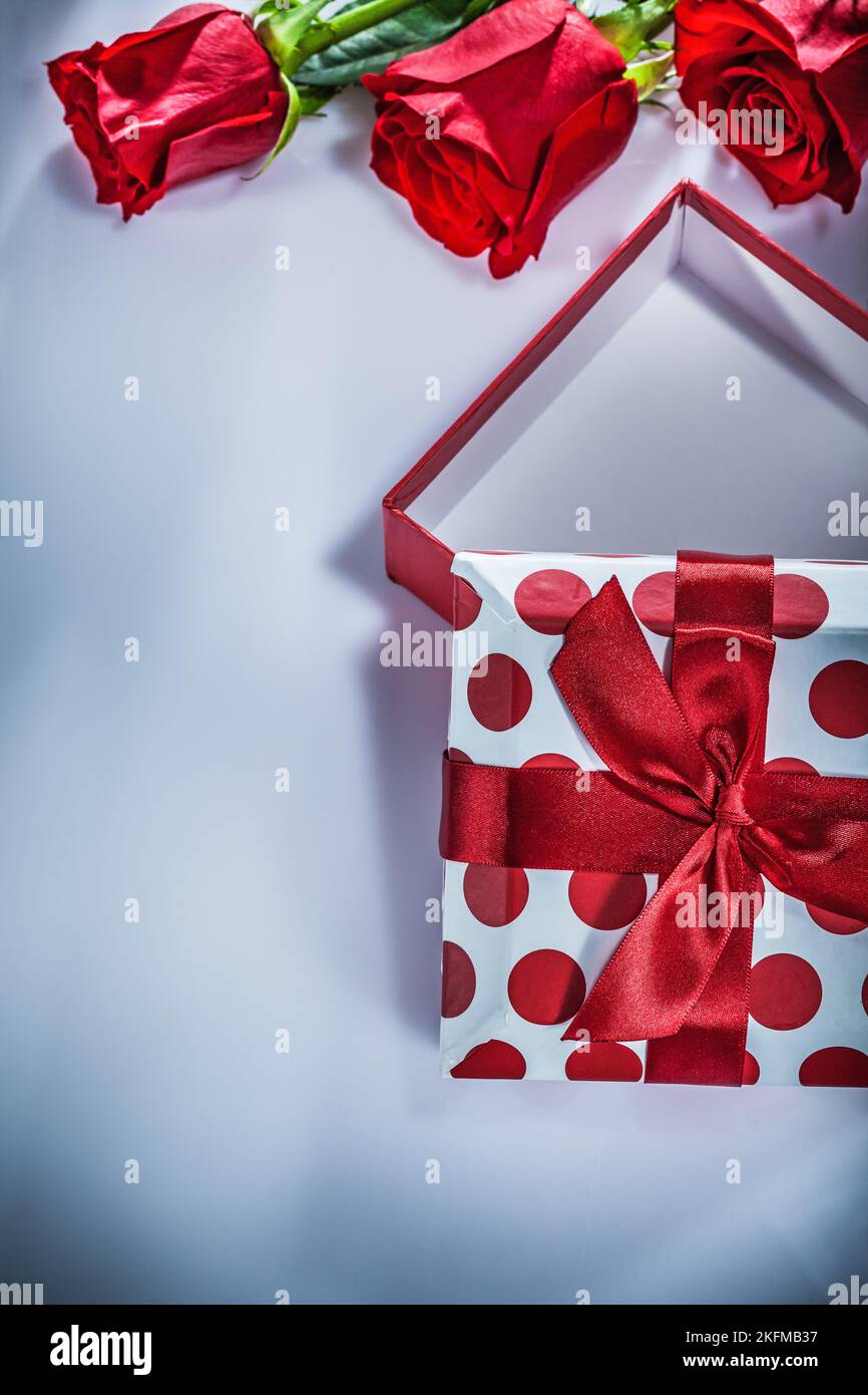 Present box bunch of roses on white background Stock Photo - Alamy