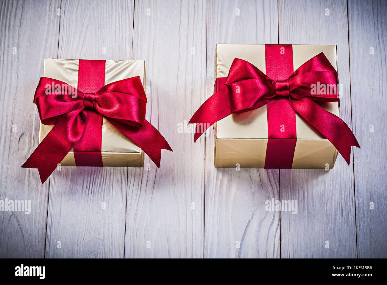 Present boxes on wooden board holidays concept Stock Photo - Alamy