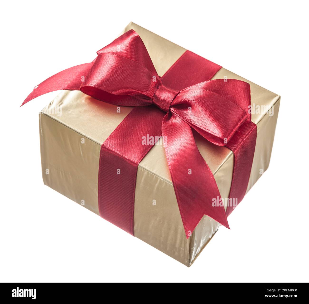 Present wrapped in glittery paper with red knot isolated on white Stock ...