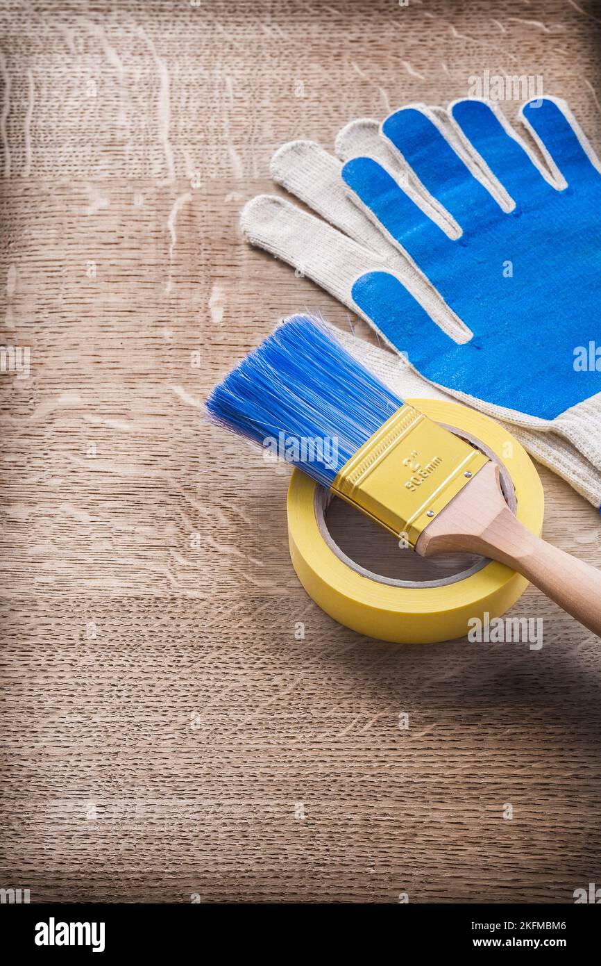 Protective gloves paint brush adhesive tape construction concept Stock ...