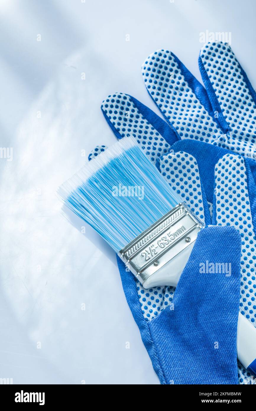 Protective gloves paint brush on white background vertical image Stock ...