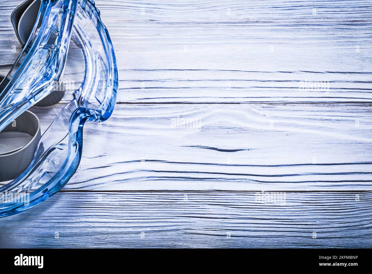Protective spectacles on wooden board construction concept Stock Photo ...